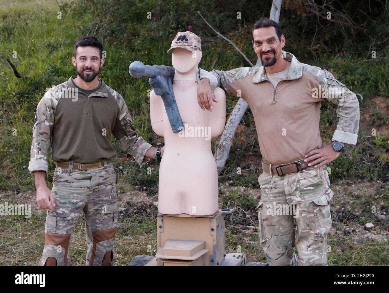 Italian snipers pose with one of the sample target mannequins before ...