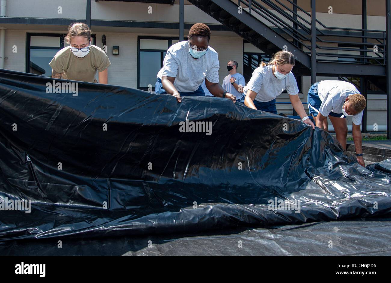 Airmen from the 436th Medical Group prepare a decontamination shelter ...
