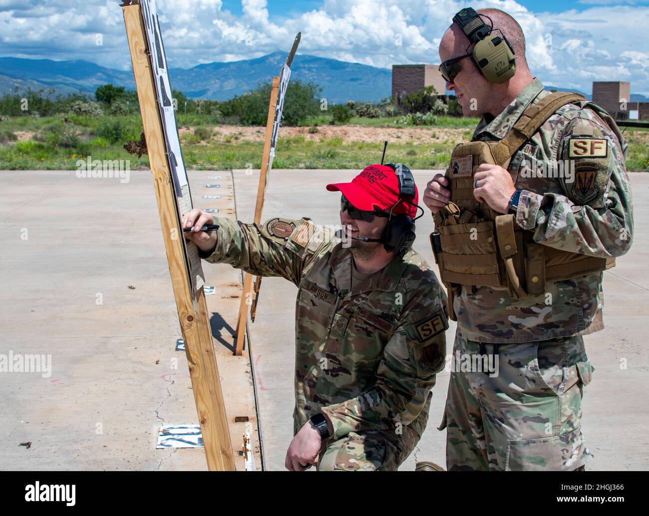 Two Airmen from the 355th Security Forces Squadron check a target ...