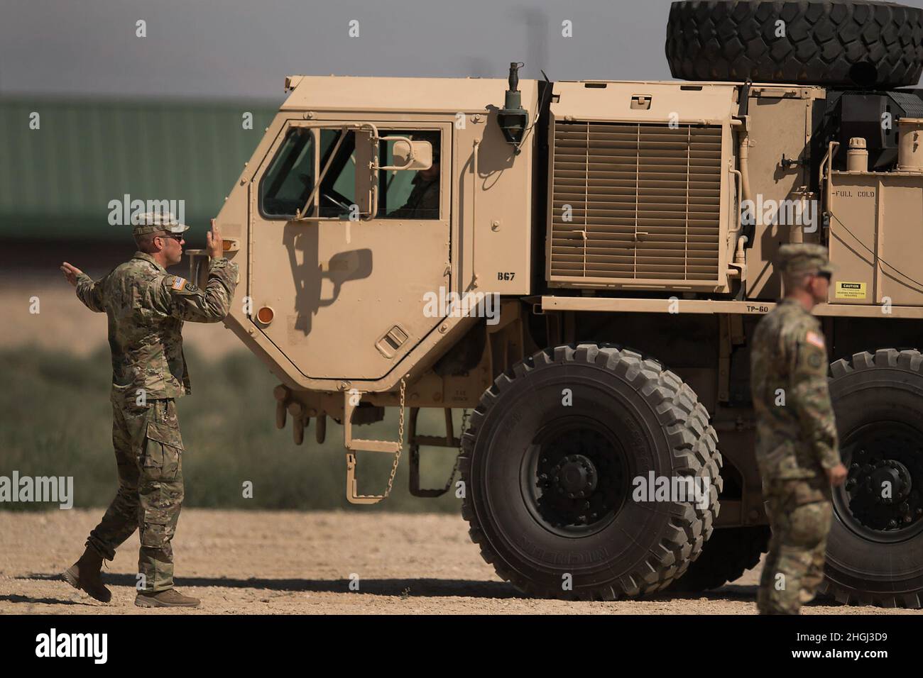 Vehicles with the 145th BSB were directed into the parking area where ...