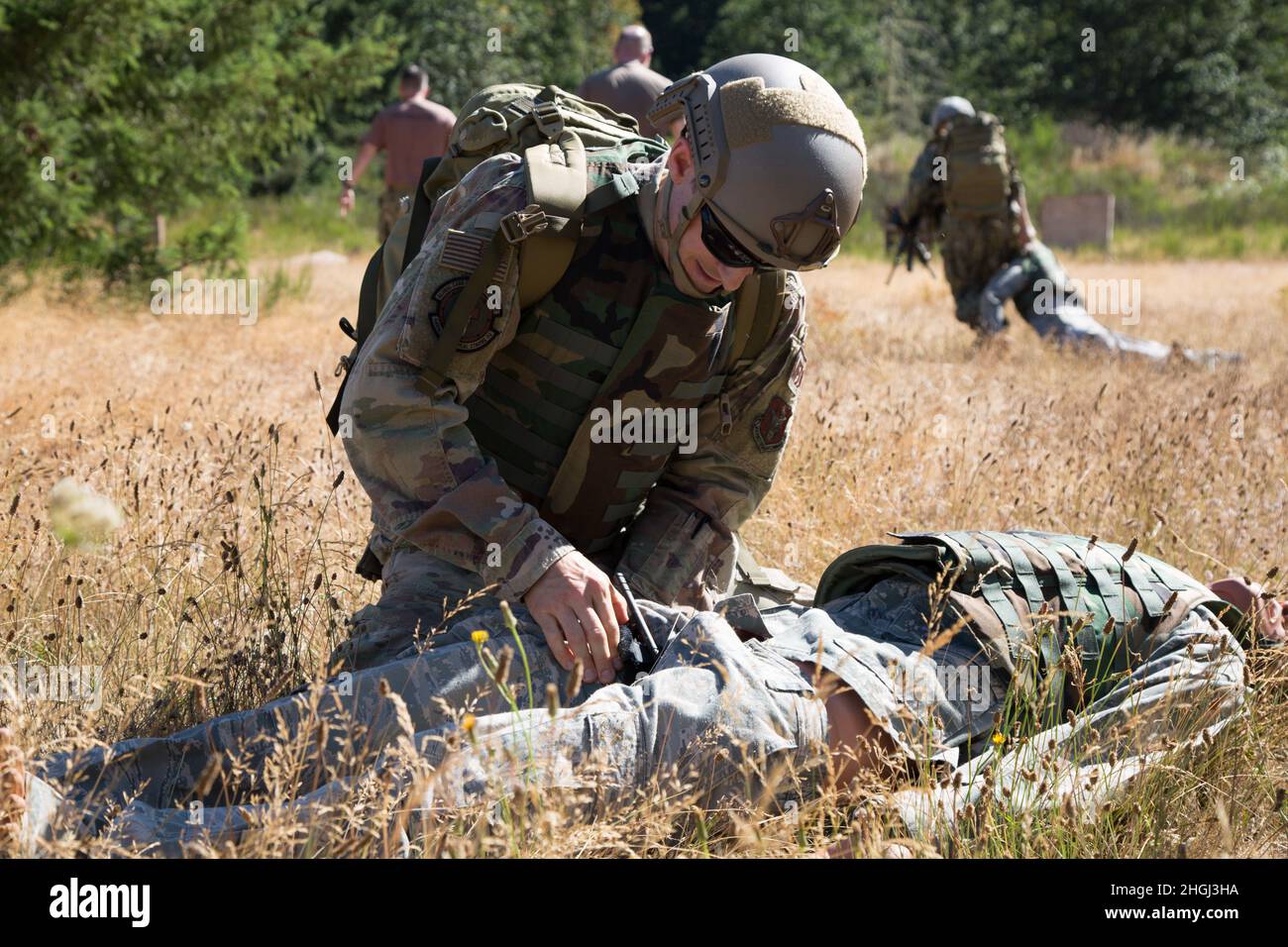 Air Force Master Sgt. Kyle Bossart, 446th ASTS first sergeant, applies ...