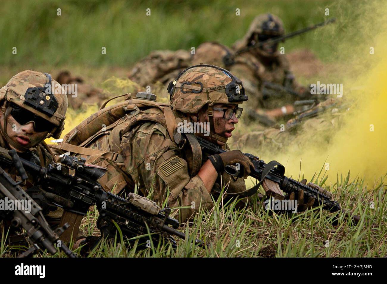 U.S. Army Soldiers with Task Force Warrior bound through yellow smoke ...