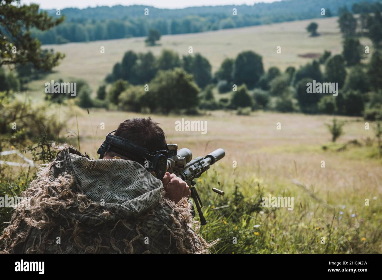 A sniper rechambers his rifle after engaging a radio controlled moving ...