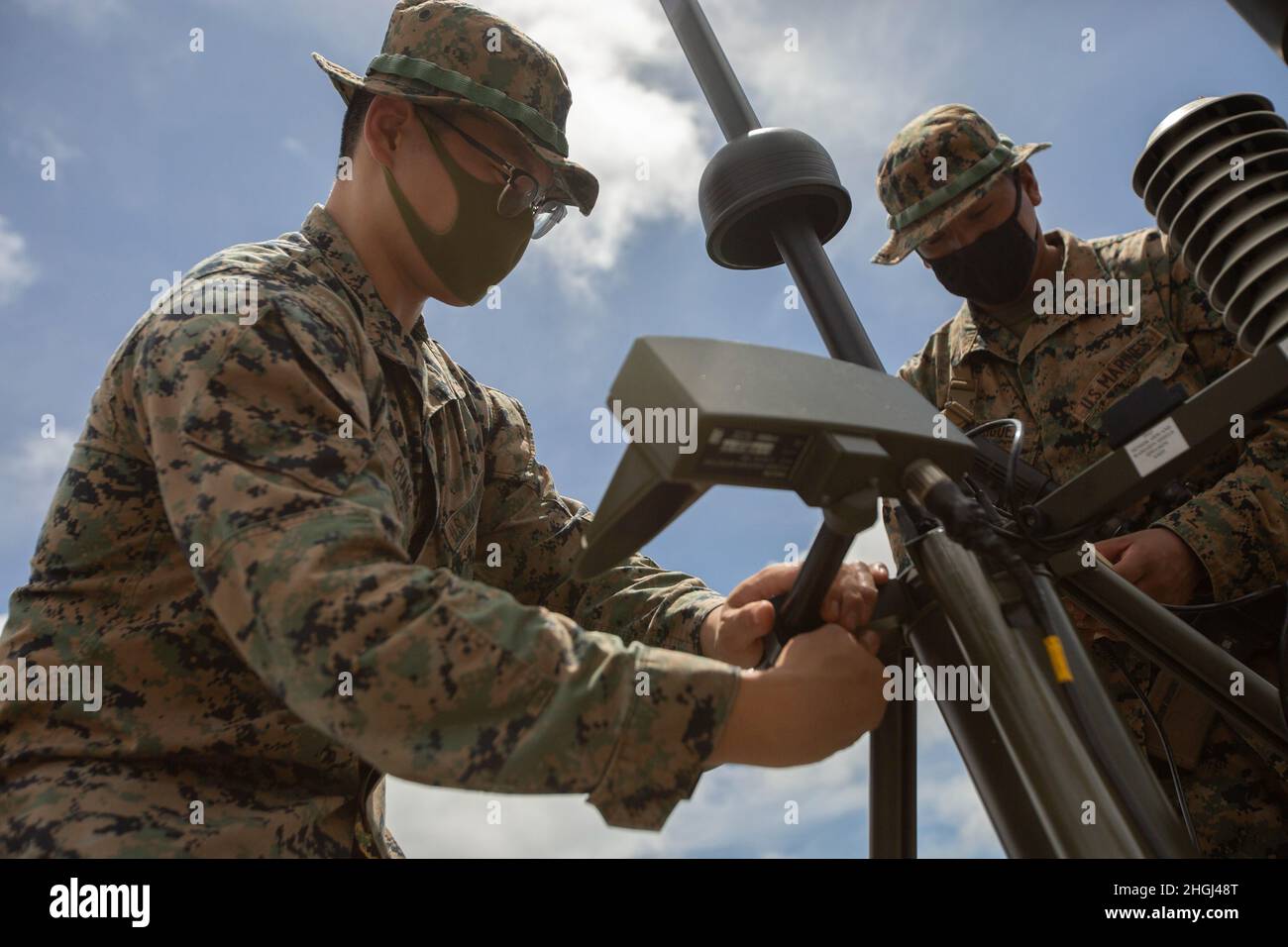 U.S. Marine Corps Cpl. Peter Chang (left), and Lance Cpl. Jean ...