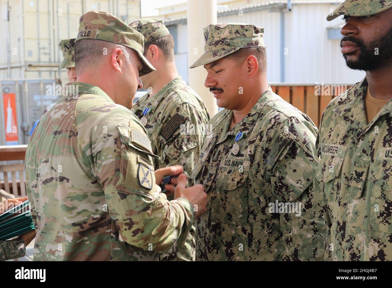 Lt. Col. Frank Tantillo, commander, Task Force Iron Gray, presents Army ...