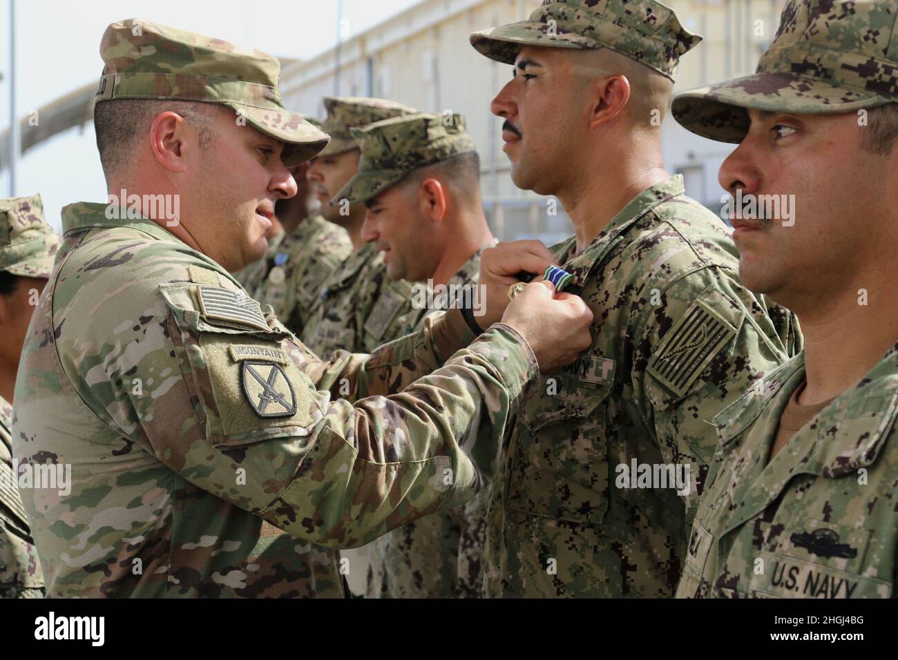 Lt. Col. Frank Tantillo, commander, Task Force Iron Gray, presents Army ...