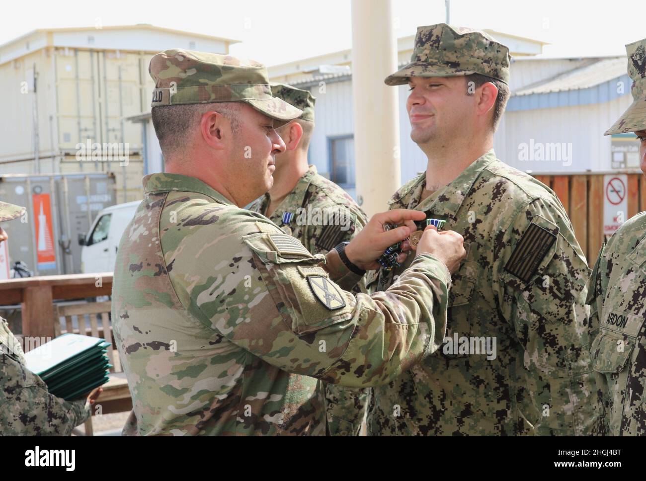 Lt. Col. Frank Tantillo, commander, Task Force Iron Gray, presents Army ...