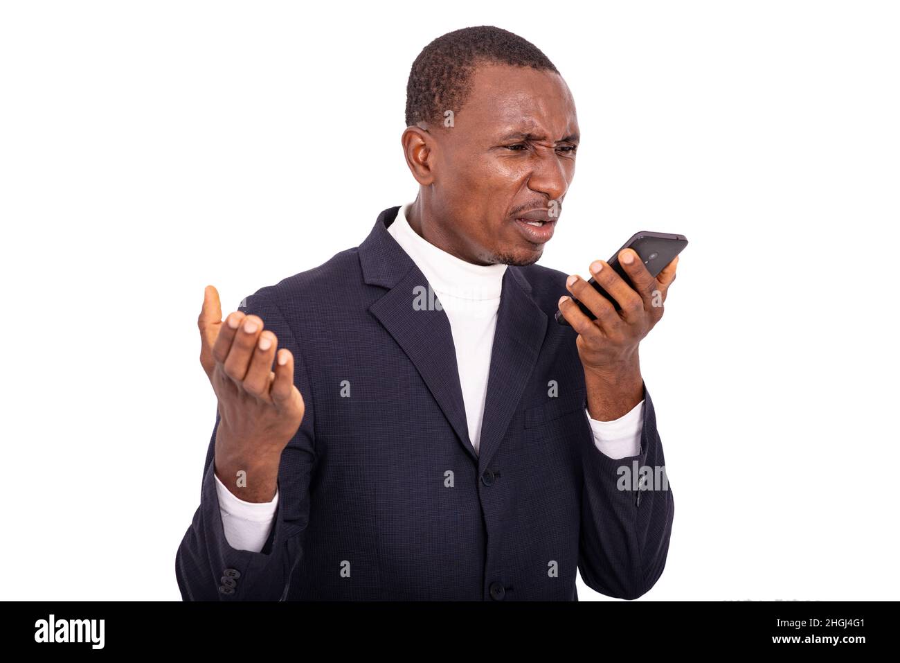angry adult businessman talking on mobile phone speaker Stock Photo - Alamy