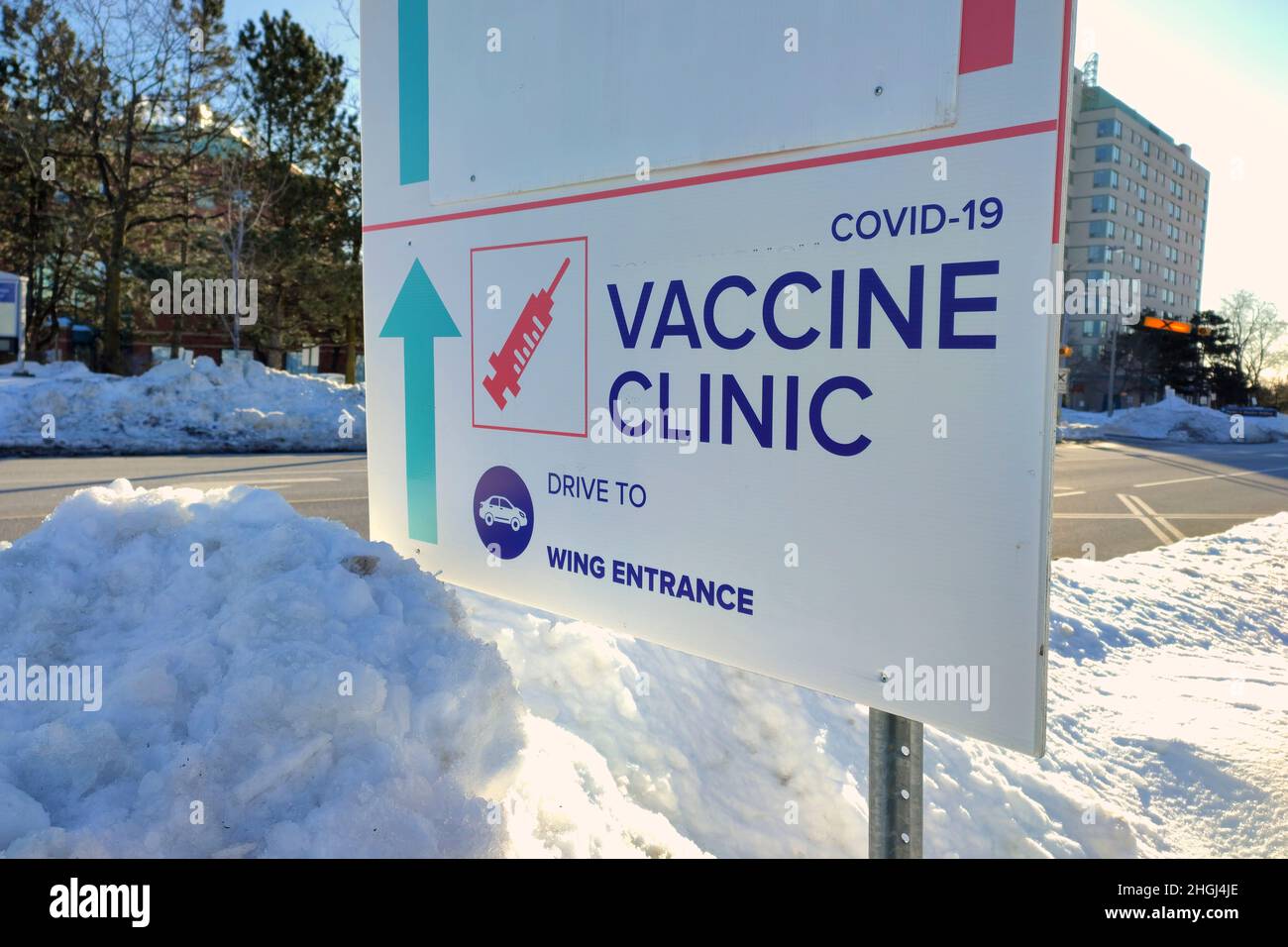 Directional sign to show direction to the entrance of Covid-19 vaccine ...
