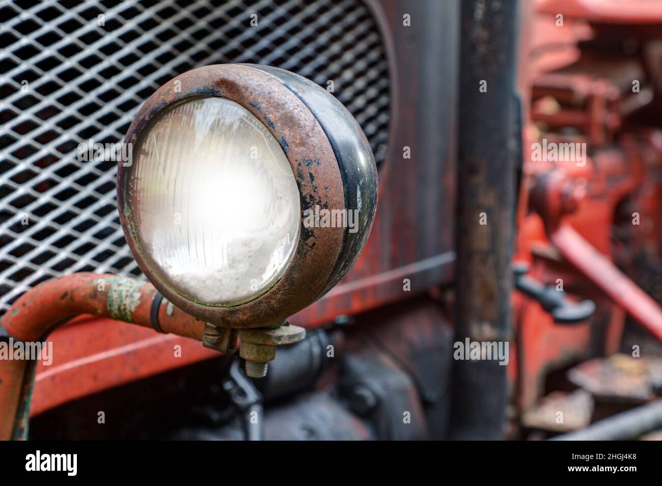 Rusted headlights on an old tractor Stock Photo - Alamy