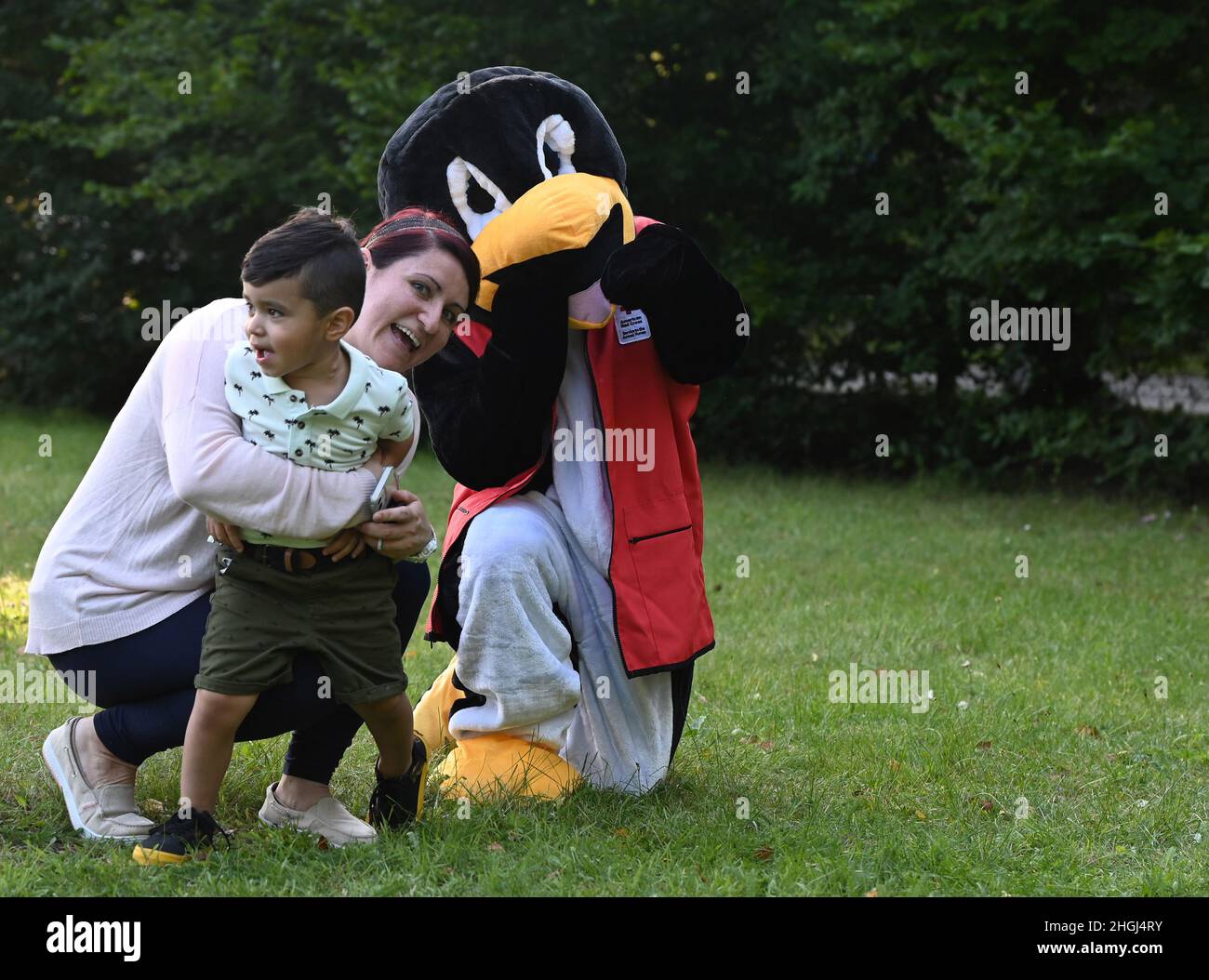 Pedro the Penguin from the American Red Cross poses for a photo with a ...
