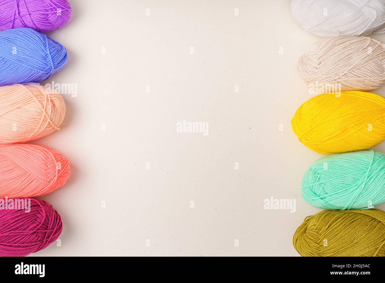 Rainbow balls of yarn is beige, yellow, burgundy, light pink, green ...