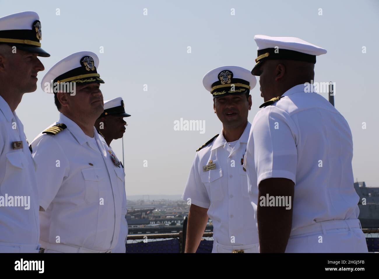 NAVAL BASE SAN DIEGO (Aug. 13, 2021) – Cmdr. Eric Winn, right, salutes ...
