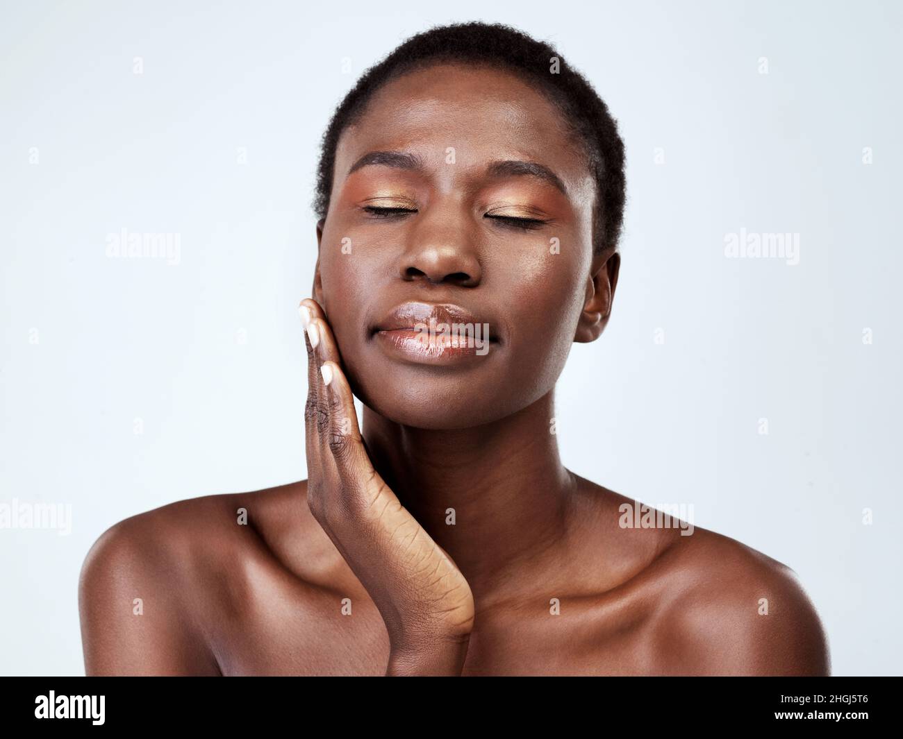 Soft skin that's a dream. Studio shot of a beautiful young woman ...