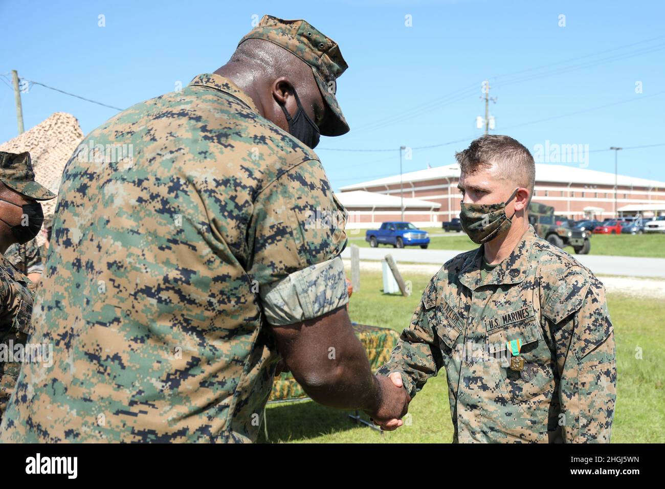 U.S. Marine Corps Lt. Col. Leron E. Lane (left), Commanding Officer, Headquarters and Support ...
