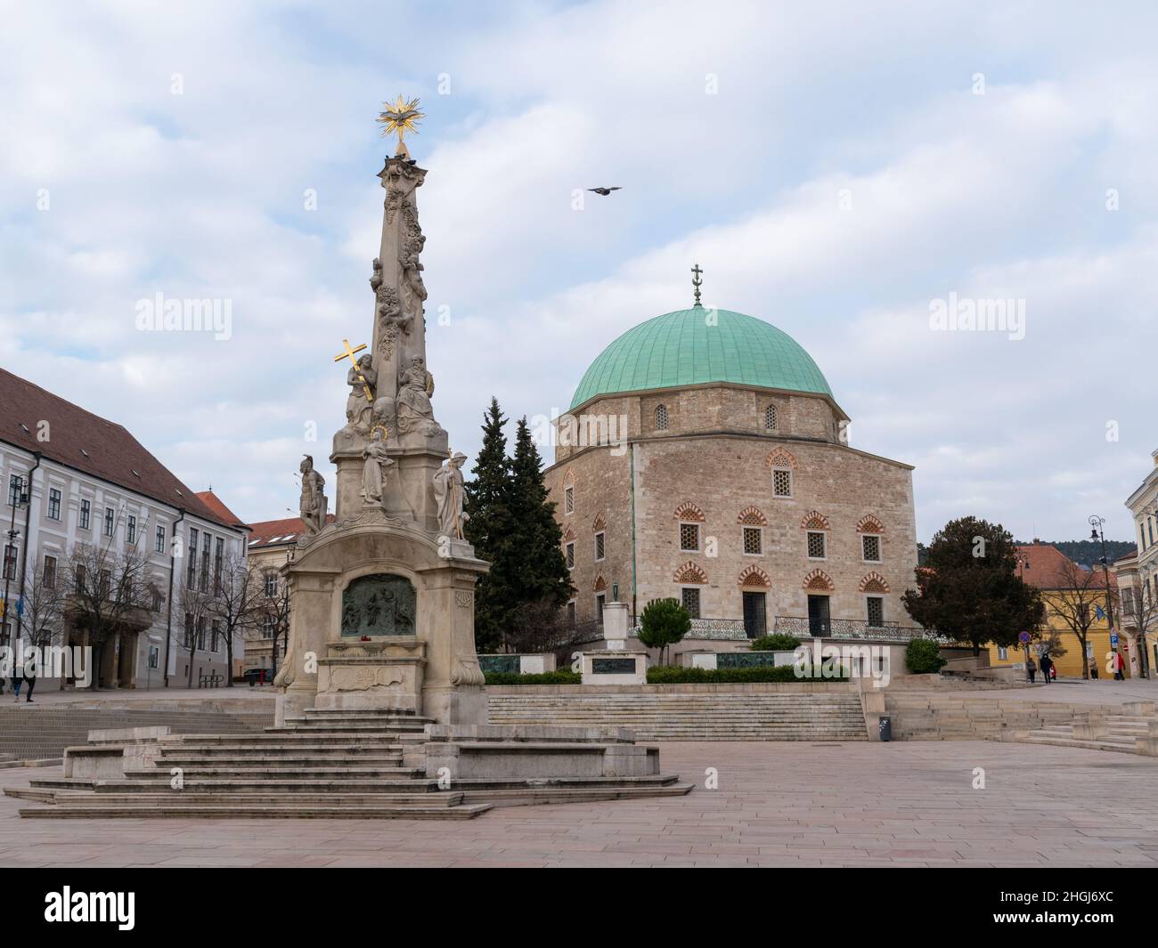 Holy Trinity Statue and Mosque of Pasha Qasim on Szechenyi square in ...