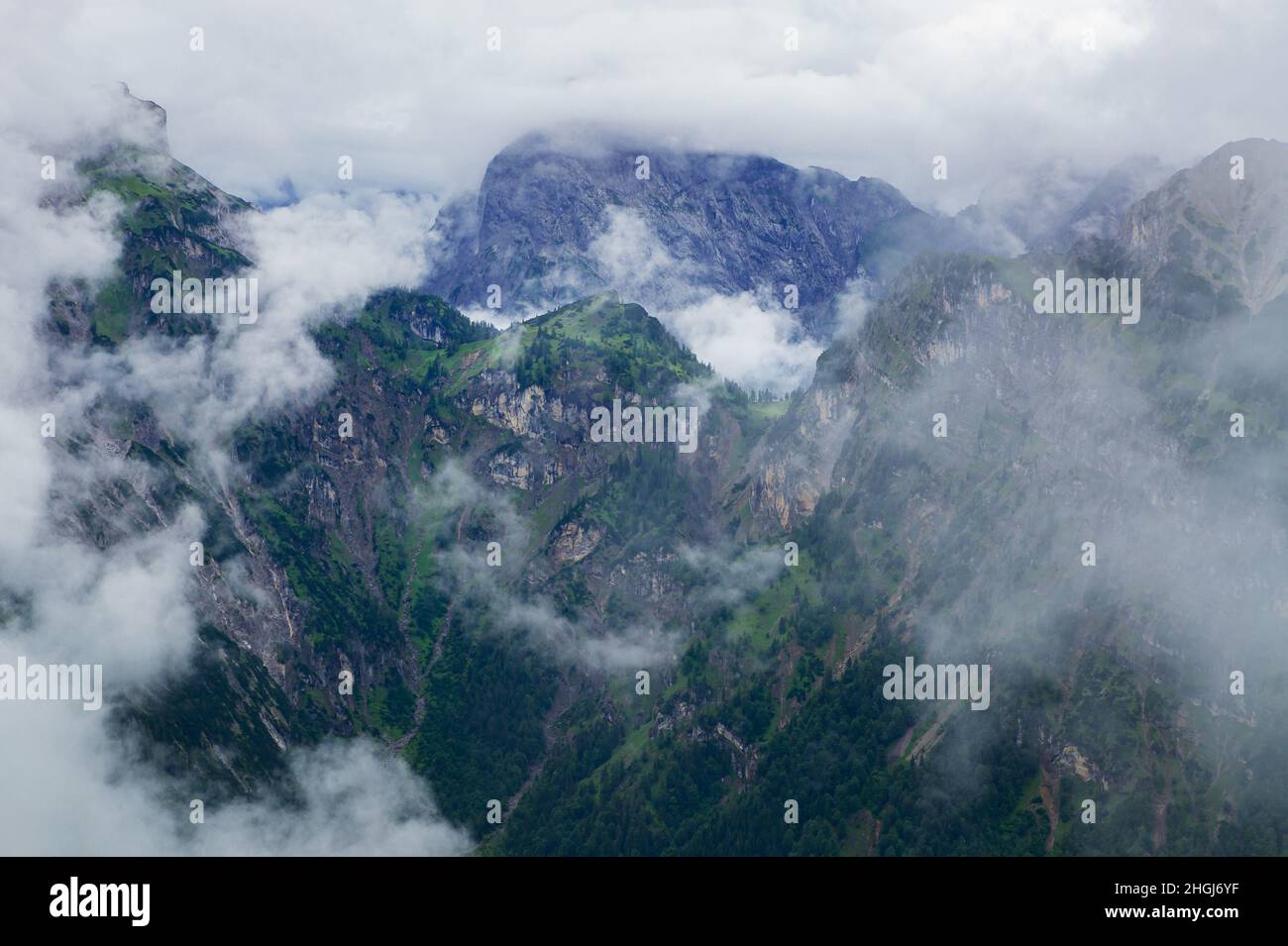 Mystical view of a mountain range in the Alps on a cloudy day Stock ...