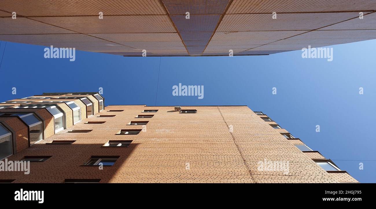 Brick high-rise buildings. Apartment building brick house Stock Photo ...