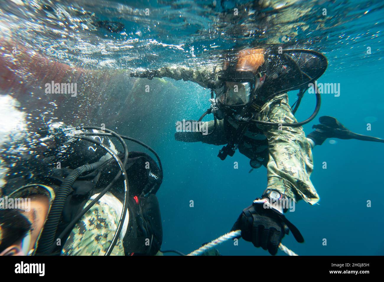 Navy Diver 2nd Class Brandon Barreto and Navy Diver 3rd Class Aiden ...