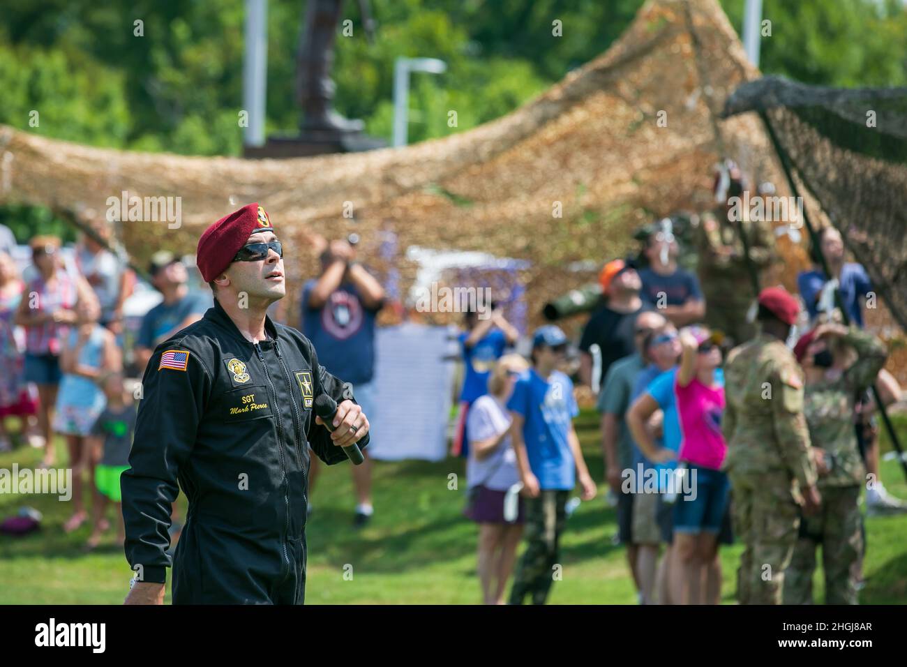 U.S. Army Spc. Mark Pierce, U.S. Army Parachute Team, narrates a ...