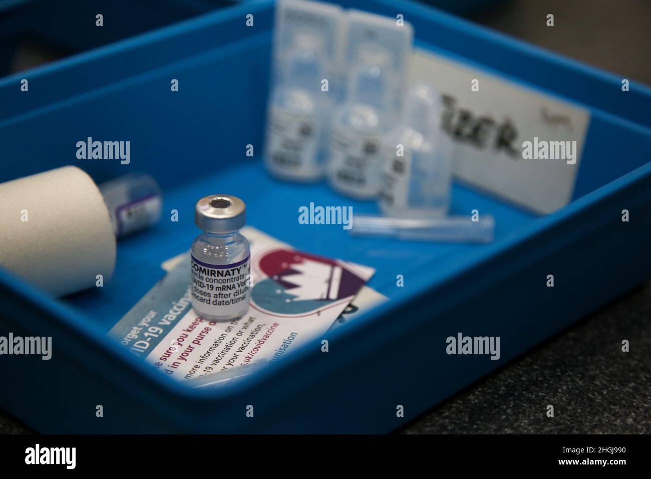 A vial containing Pfizer/BioNTech Covid-19 booster vaccine and a ...