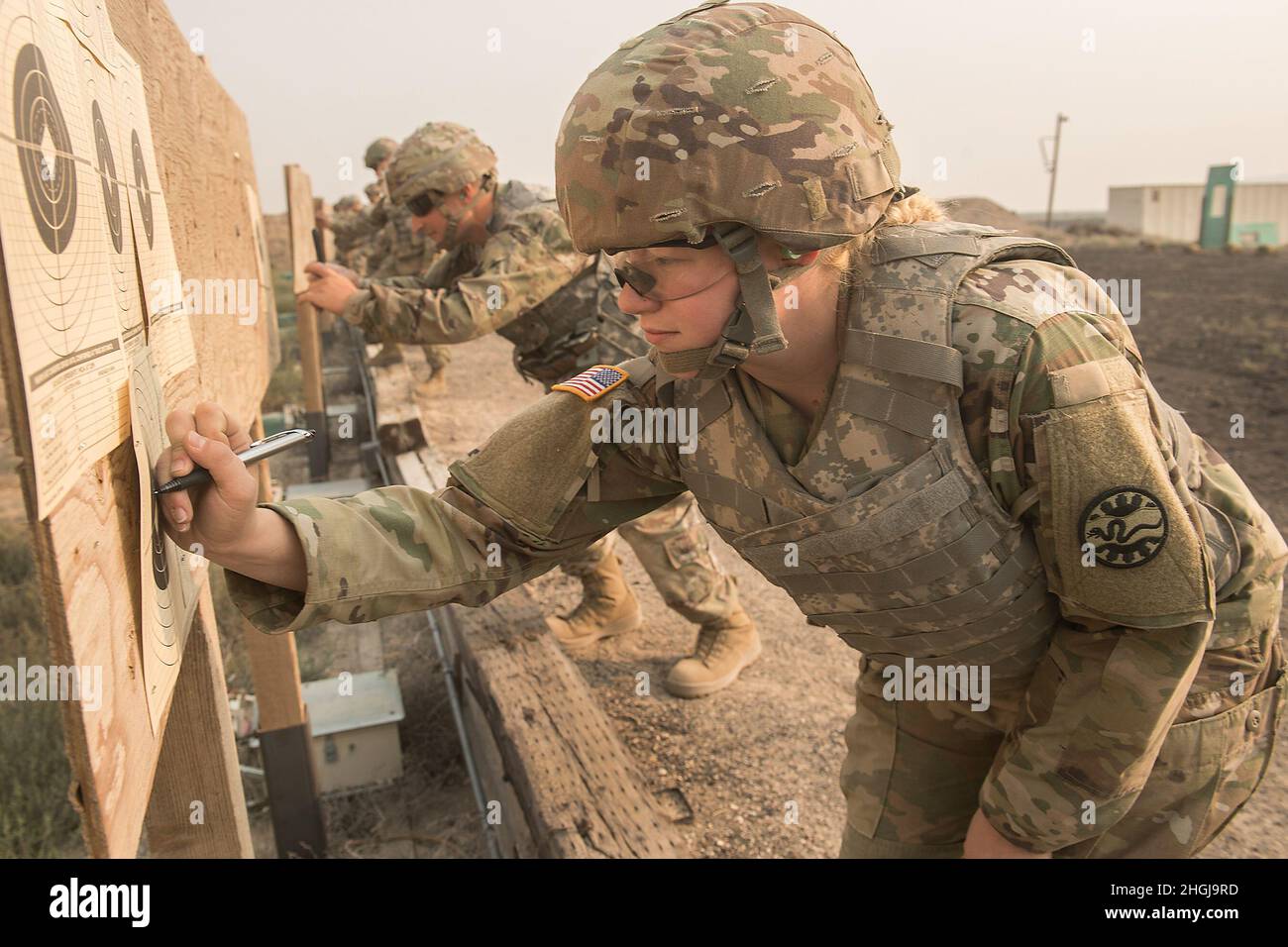 Idaho Army National Guard Spc. Sydni Bohlmann with the 145th BSB marks ...