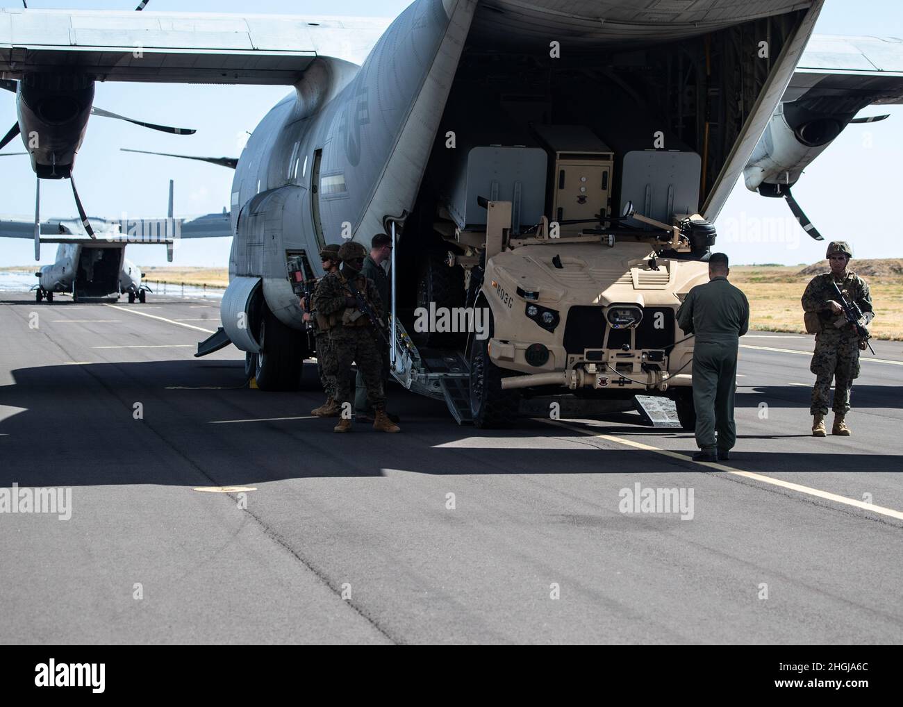 Artillery Marines from 1st Battalion, 12th Marines provide security as ...