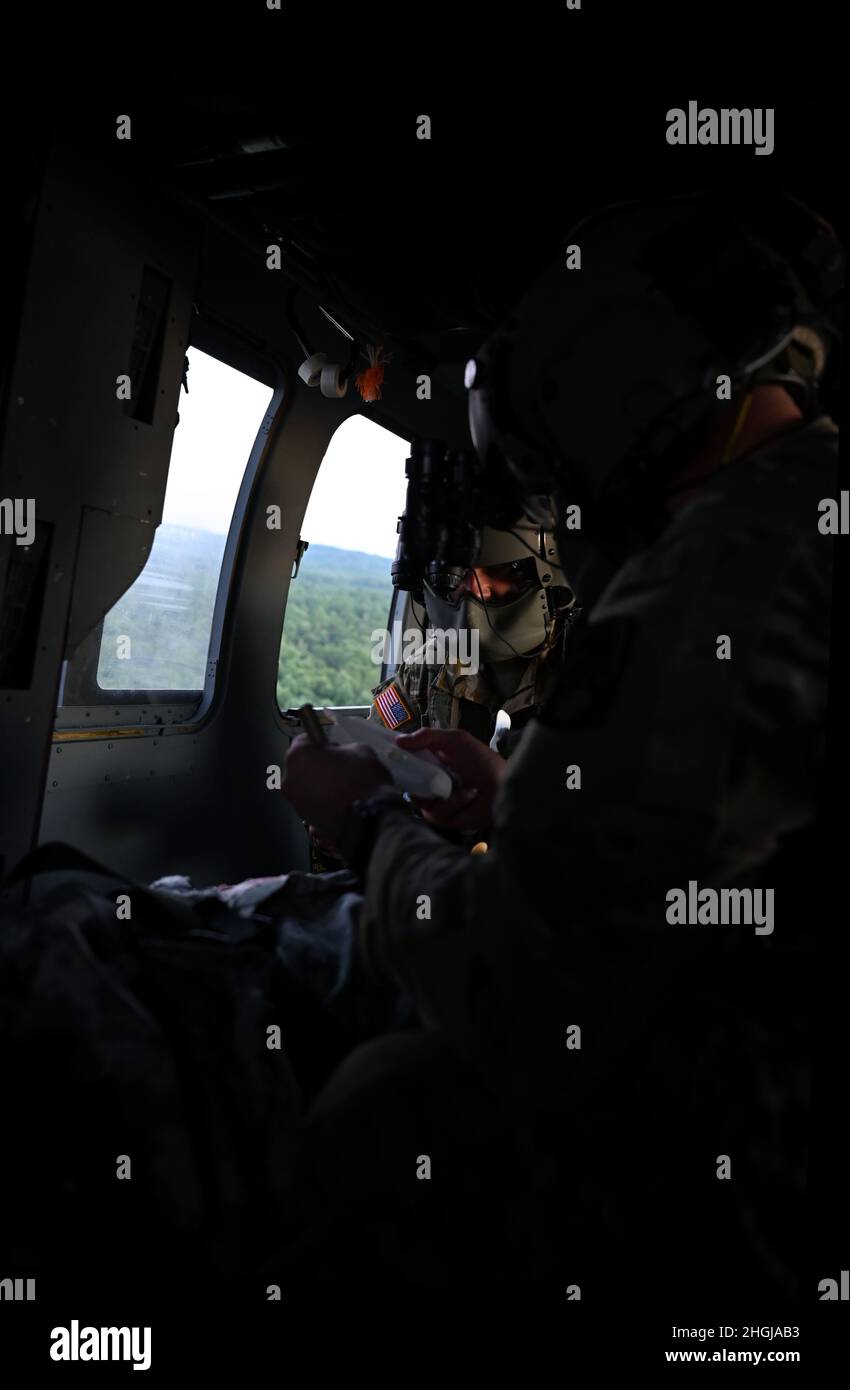 From left, U.S. Army Sgt. Jonathan Jeffries, a crew chief, and Staff ...