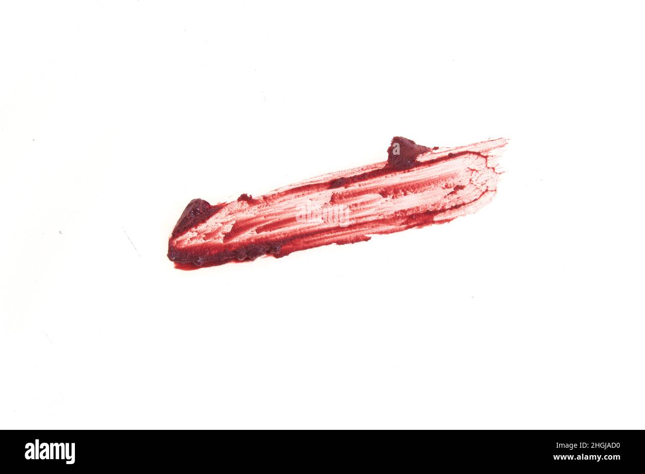 The smear and texture of lipstick. The pink color is highlighted on an ...