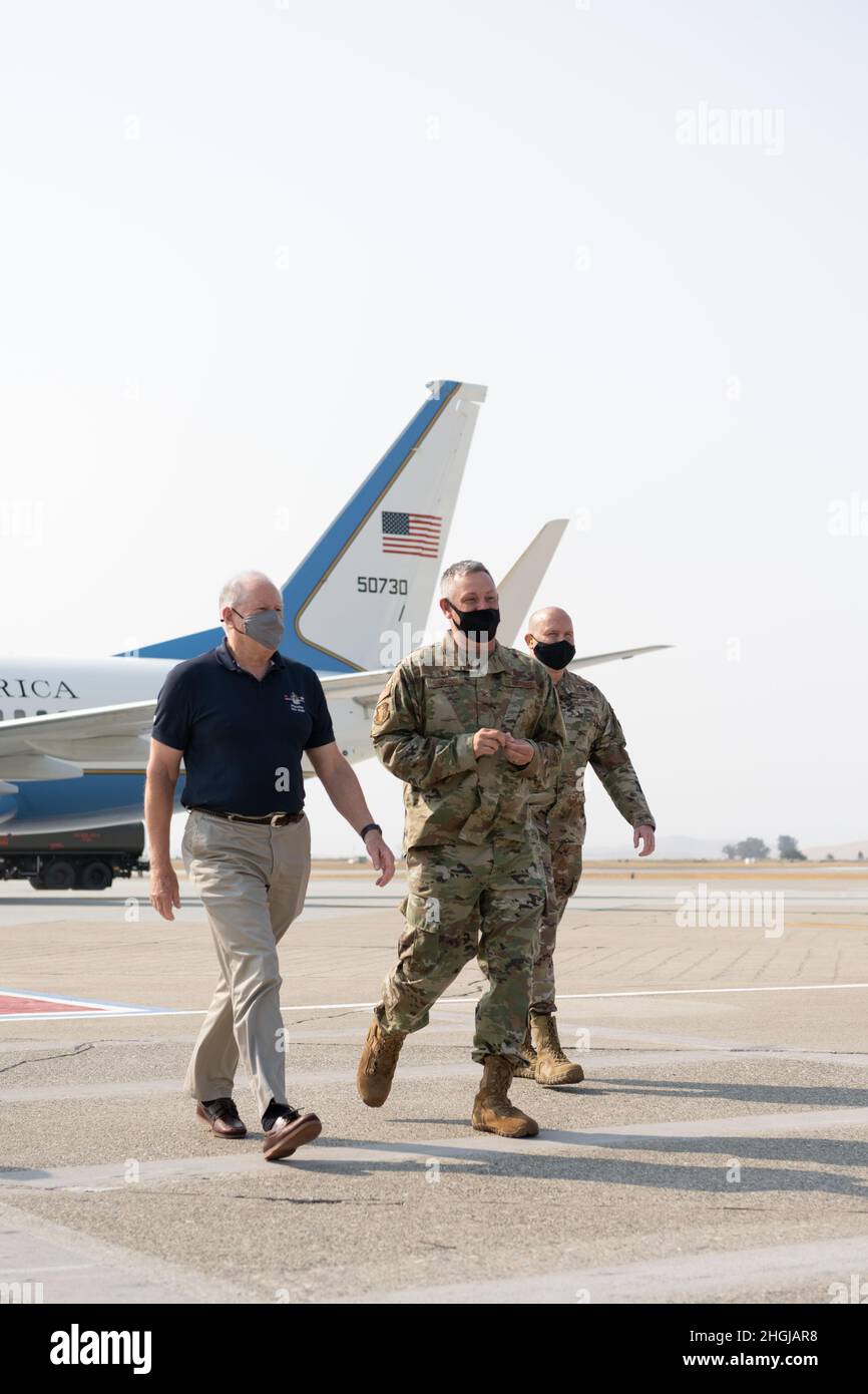 U.S. Air Force Col. Corey Simmons, center, 60th Air Mobility Commander ...