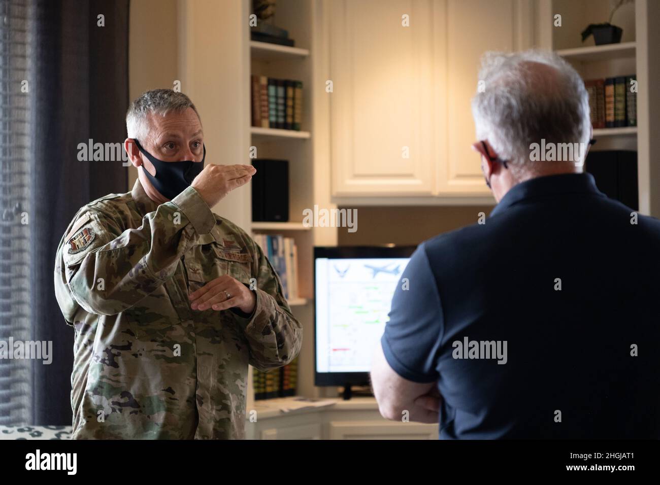 U.S. Air Force Col. Corey Simmons, left, 60th Air Mobility Commander ...