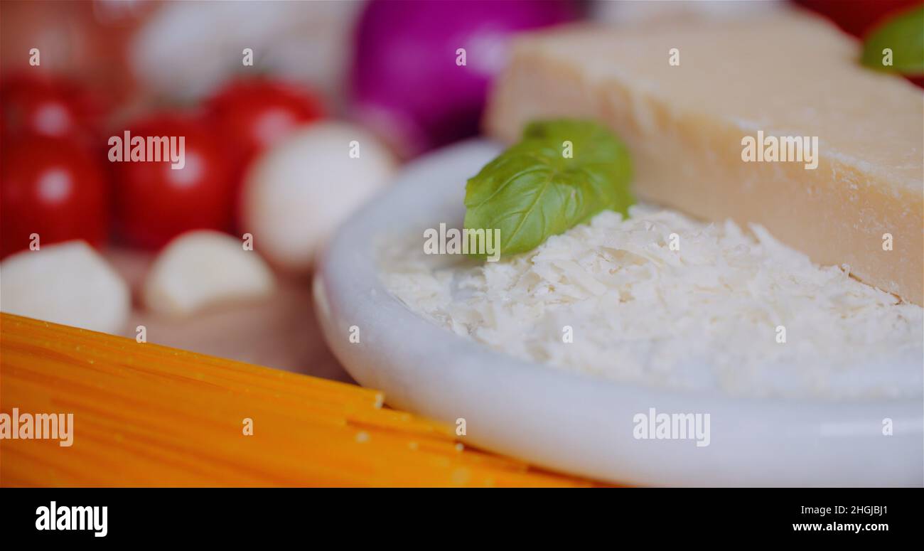 Fresh Food Ingredients On Wooden Table In Kitchen. grate parmesan ...
