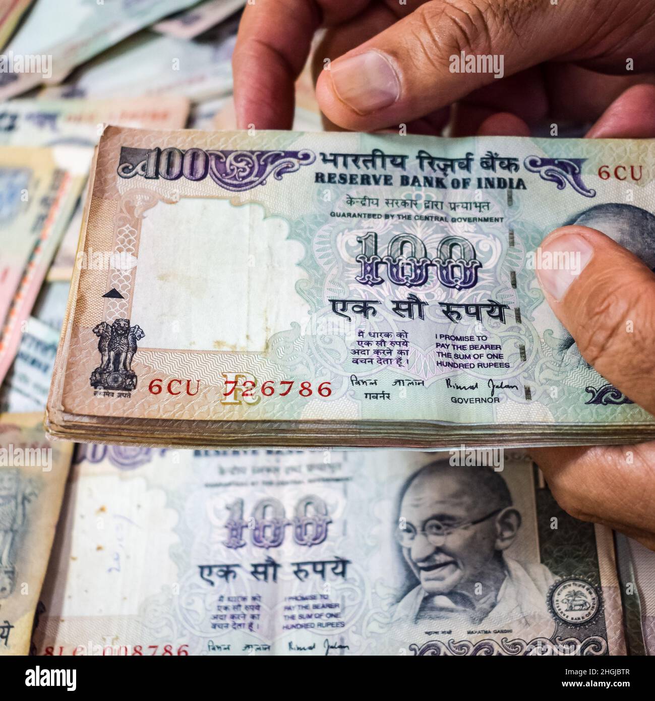 Old One Hundred Rupee notes combined on the table, India money on the ...