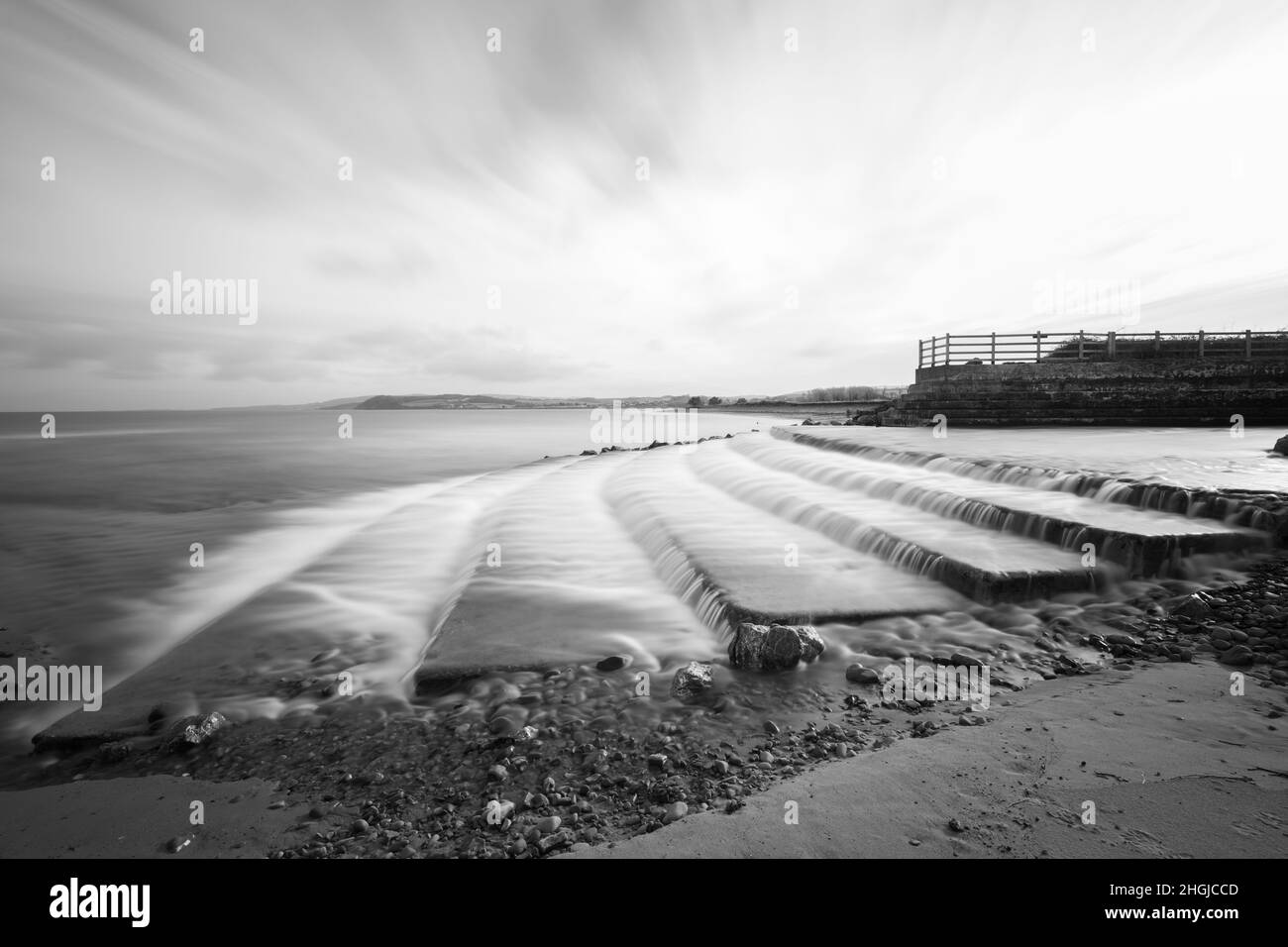 Long exposure of the waterfall from the river Avill flowing onto ...
