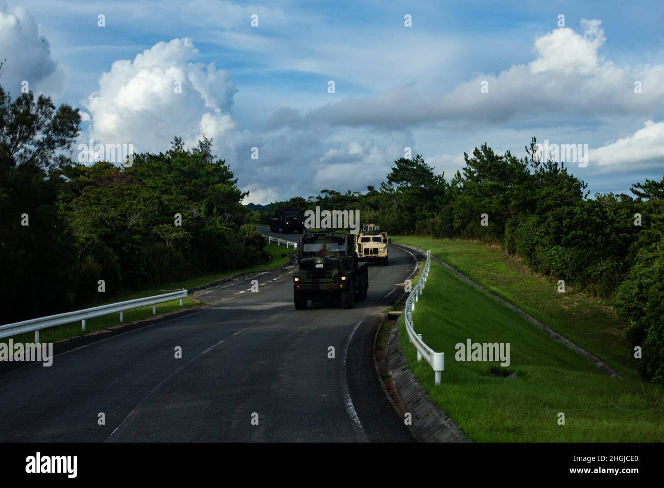 U.S. Marines drive a Medium Tactical Vehicle Replacement (MVTR) and ...