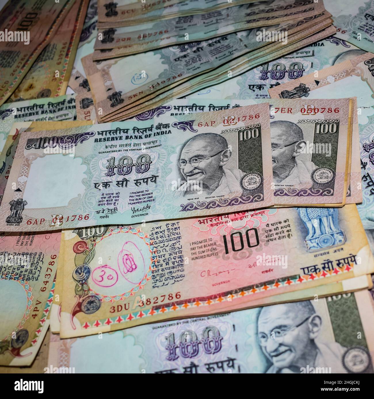 Old One Hundred Rupee notes combined on the table, India money on the ...