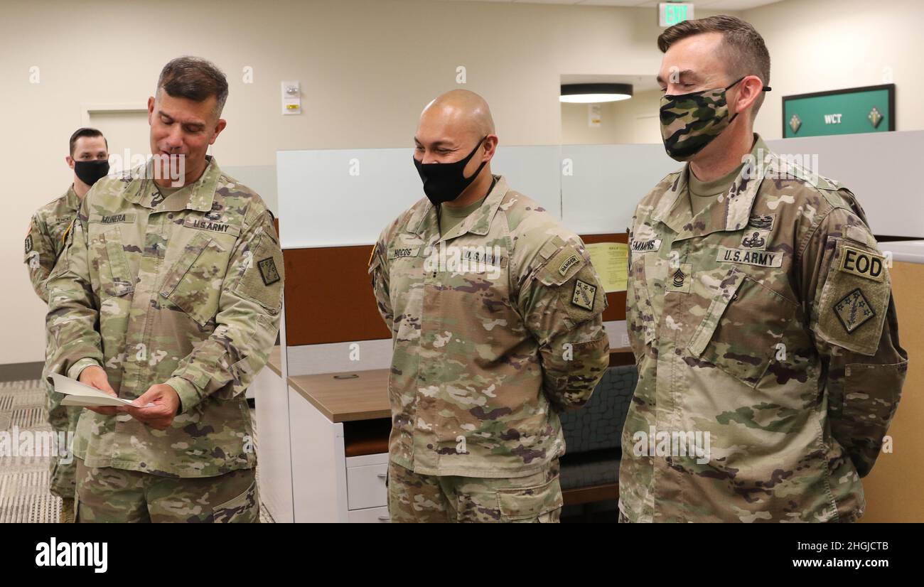 Then Brig. Gen. Antonio V. Munera (left), the commanding general for 20th CBRNE Command, reads a ...