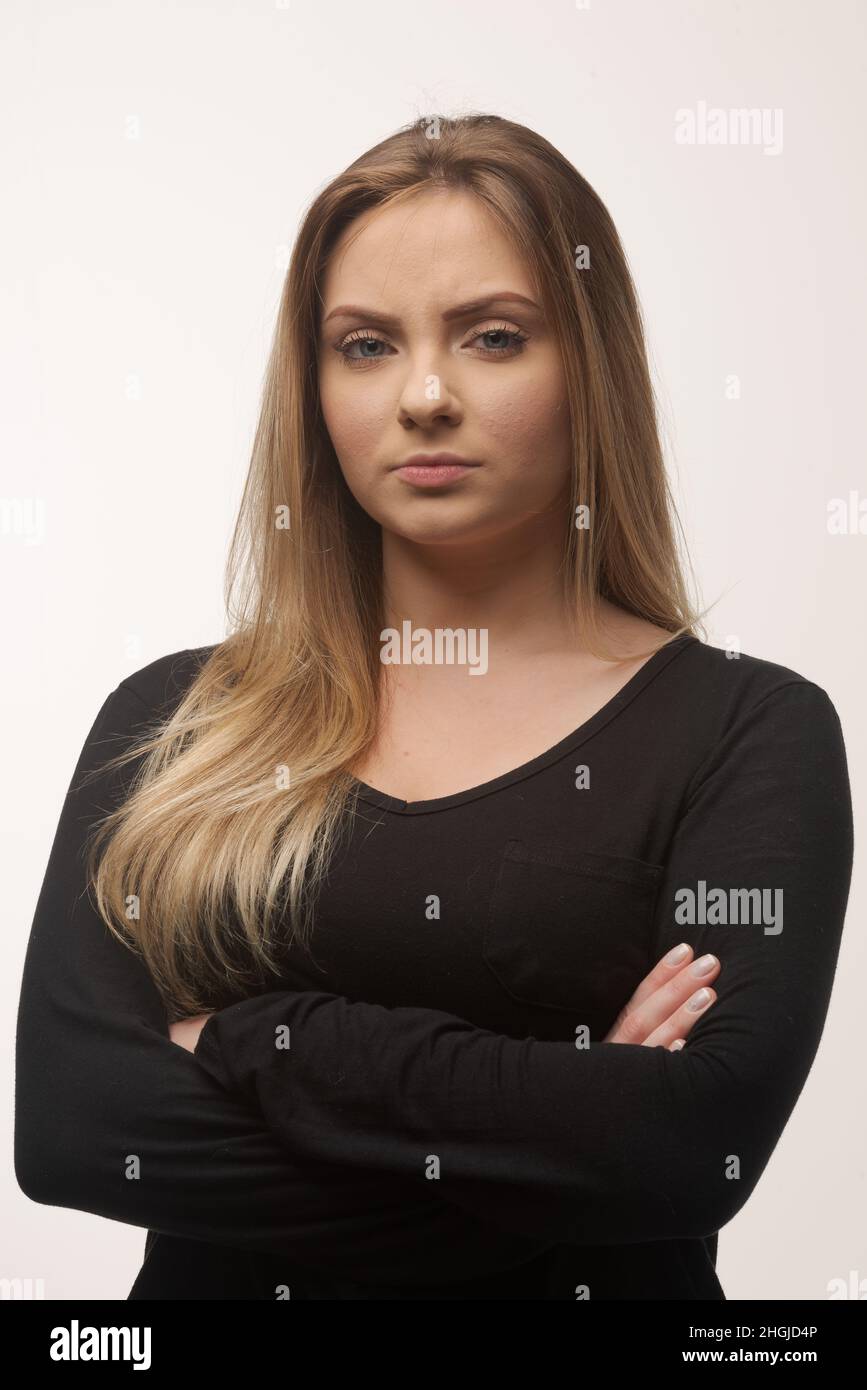 Portrait of white caucasian woman angry disappointed furious in white ...