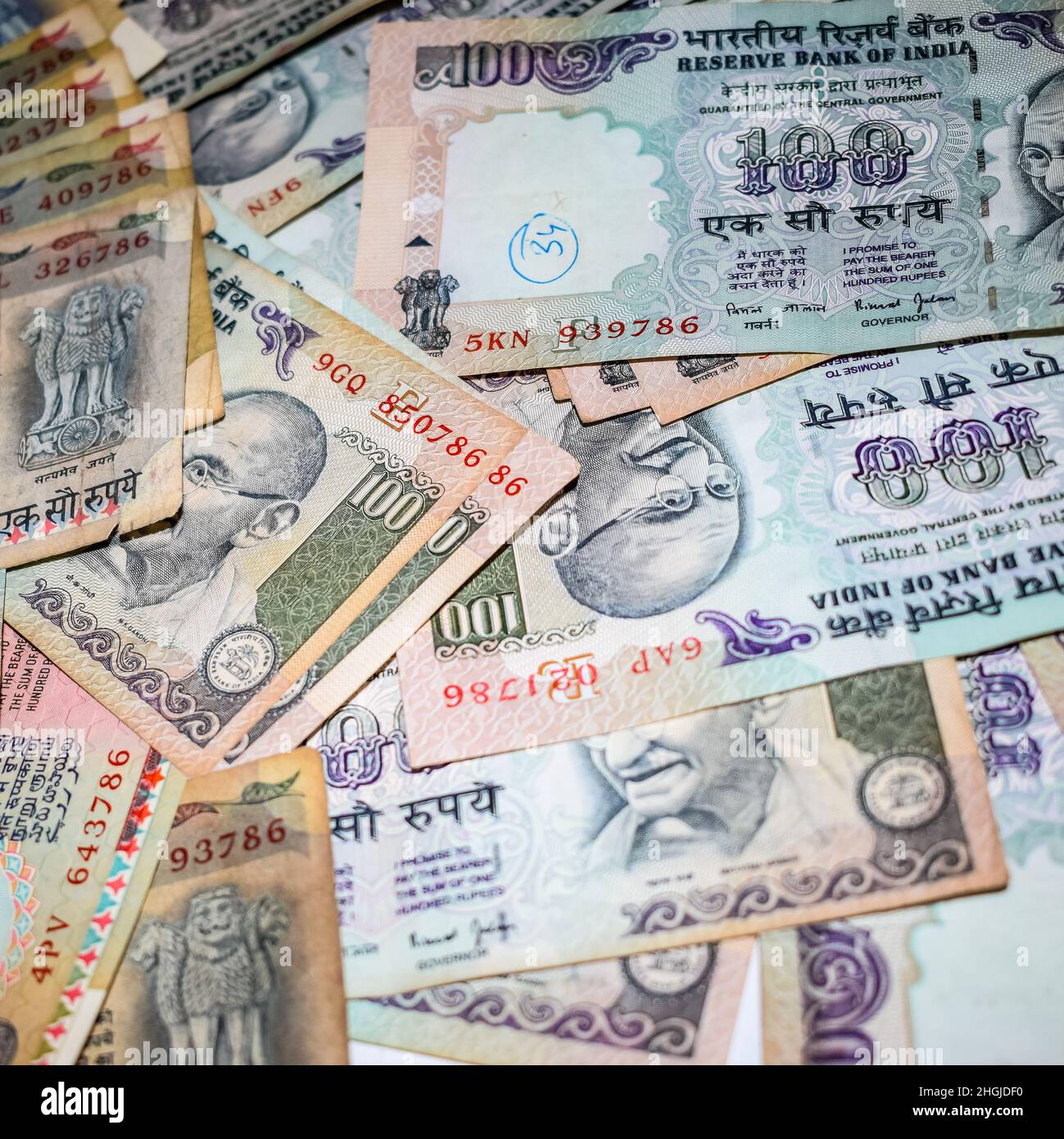 Old One Hundred Rupee notes combined on the table, India money on the ...