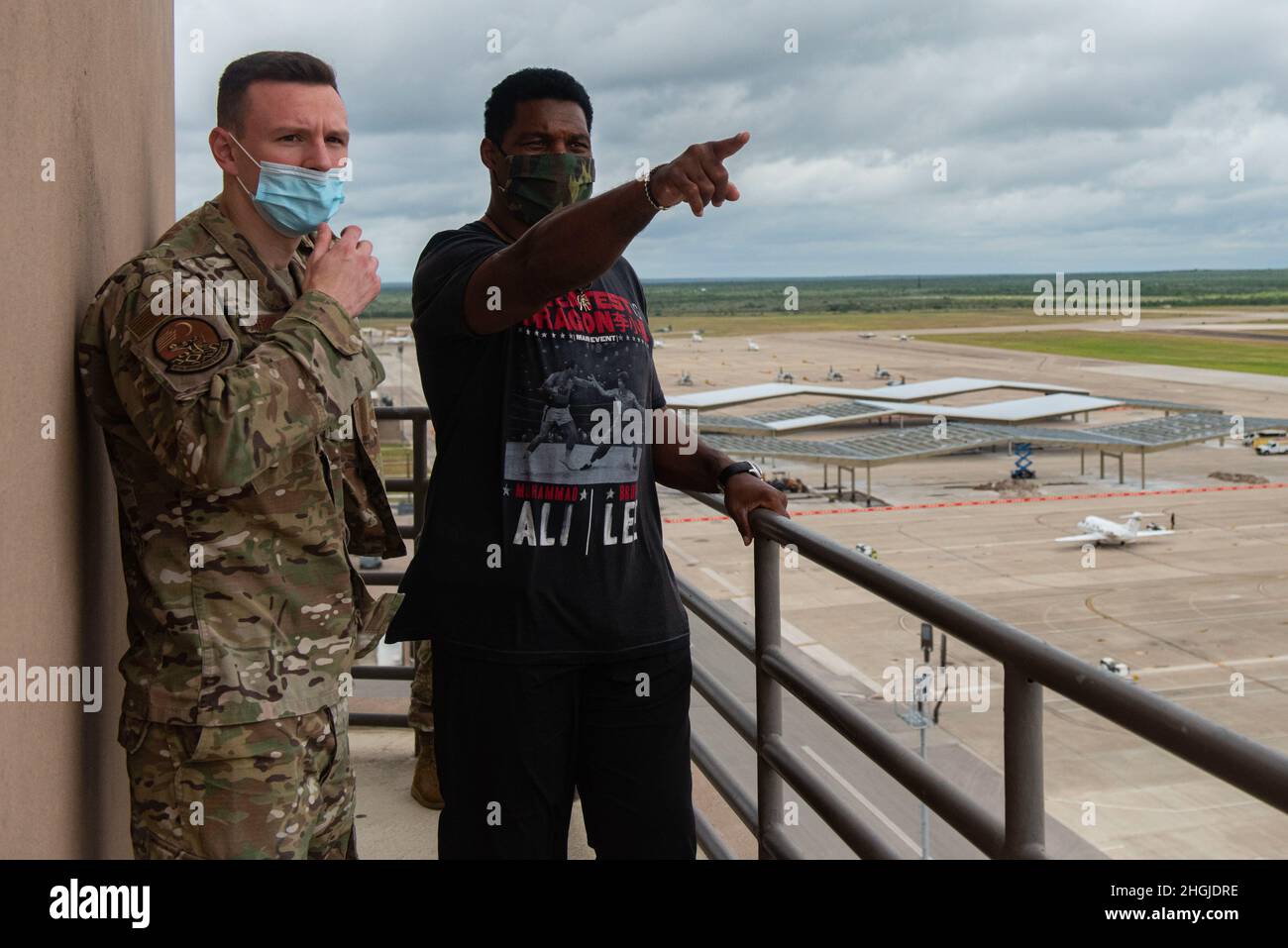 Herschel Walker looks over the Laughlin Air Force Base flight-line as a ...