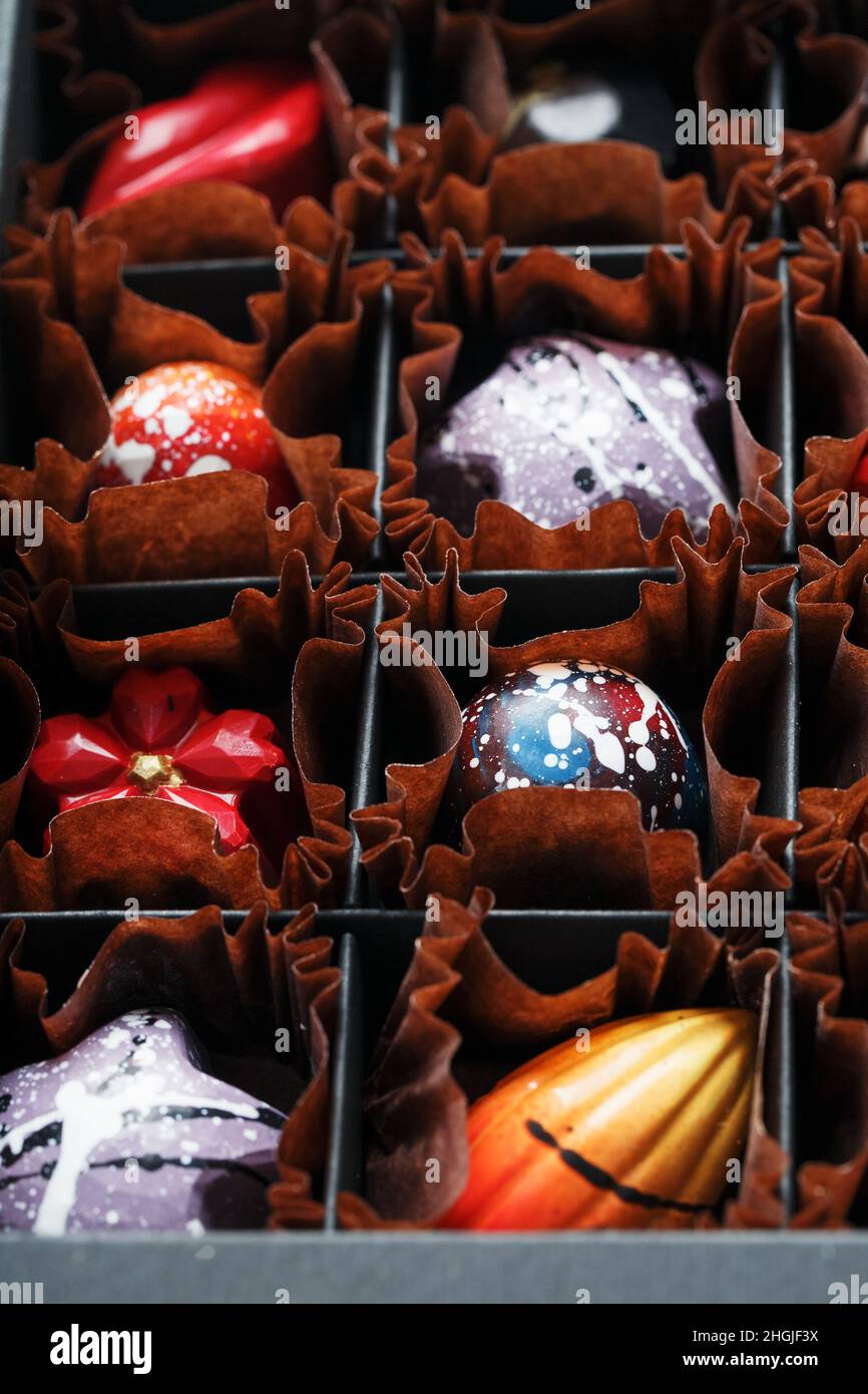 Handmade chocolates in a box. Production of confectionery products ...