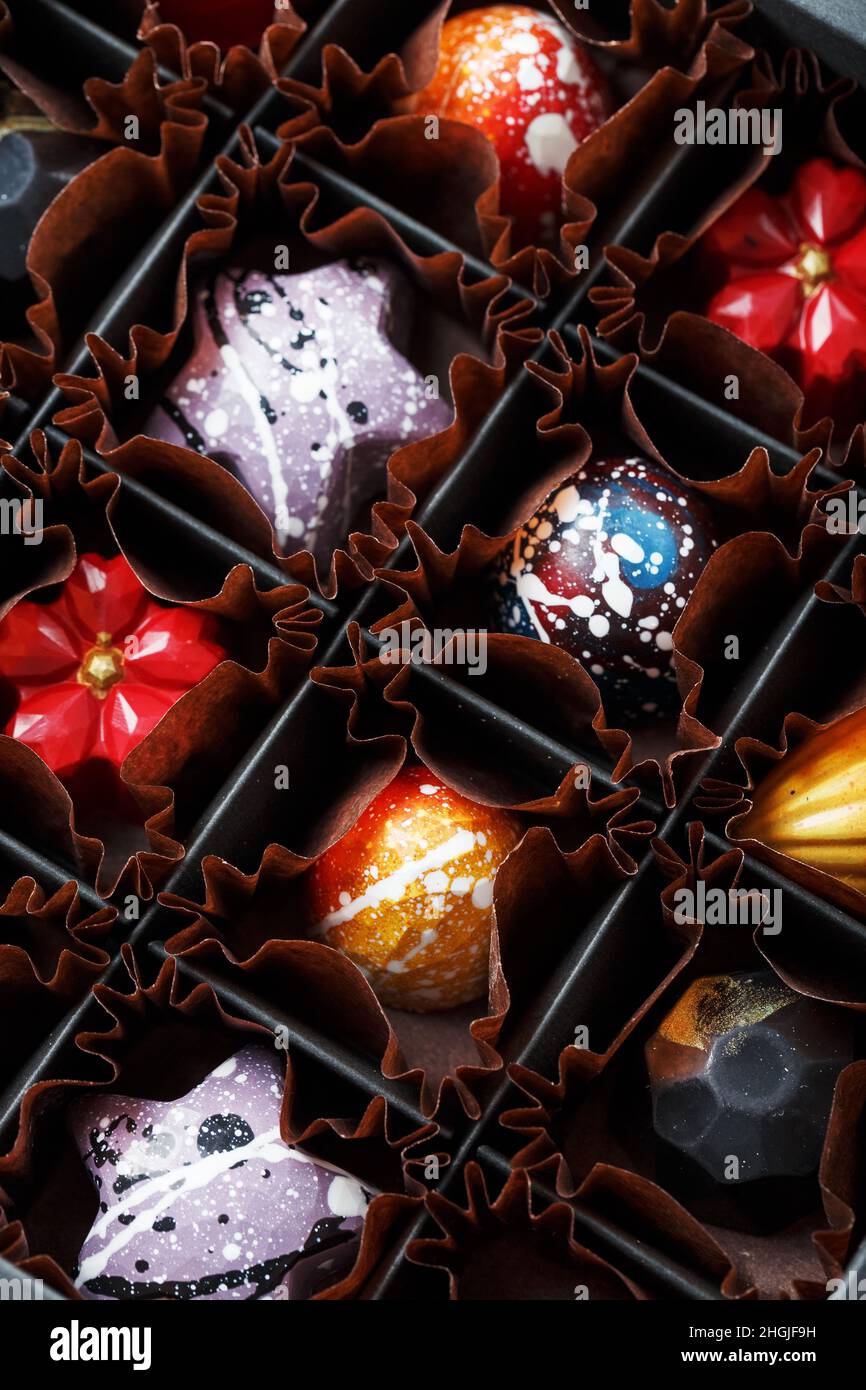 Handmade chocolates in a box. Production of confectionery products ...