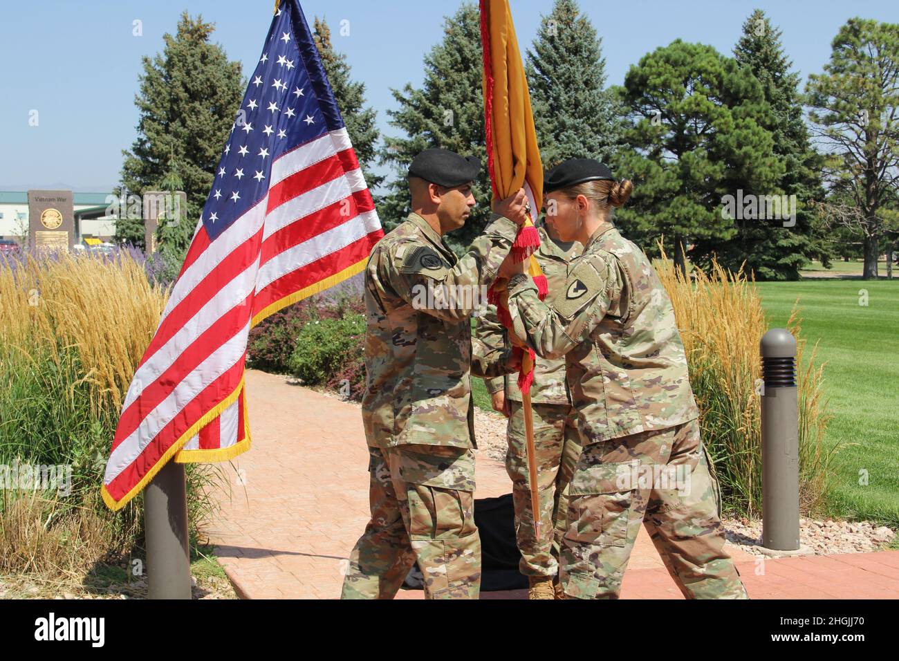 Sgt. Maj. Angel Del Valle, left, accepts the 918th Contracting Battalion colors from Lt. Col ...