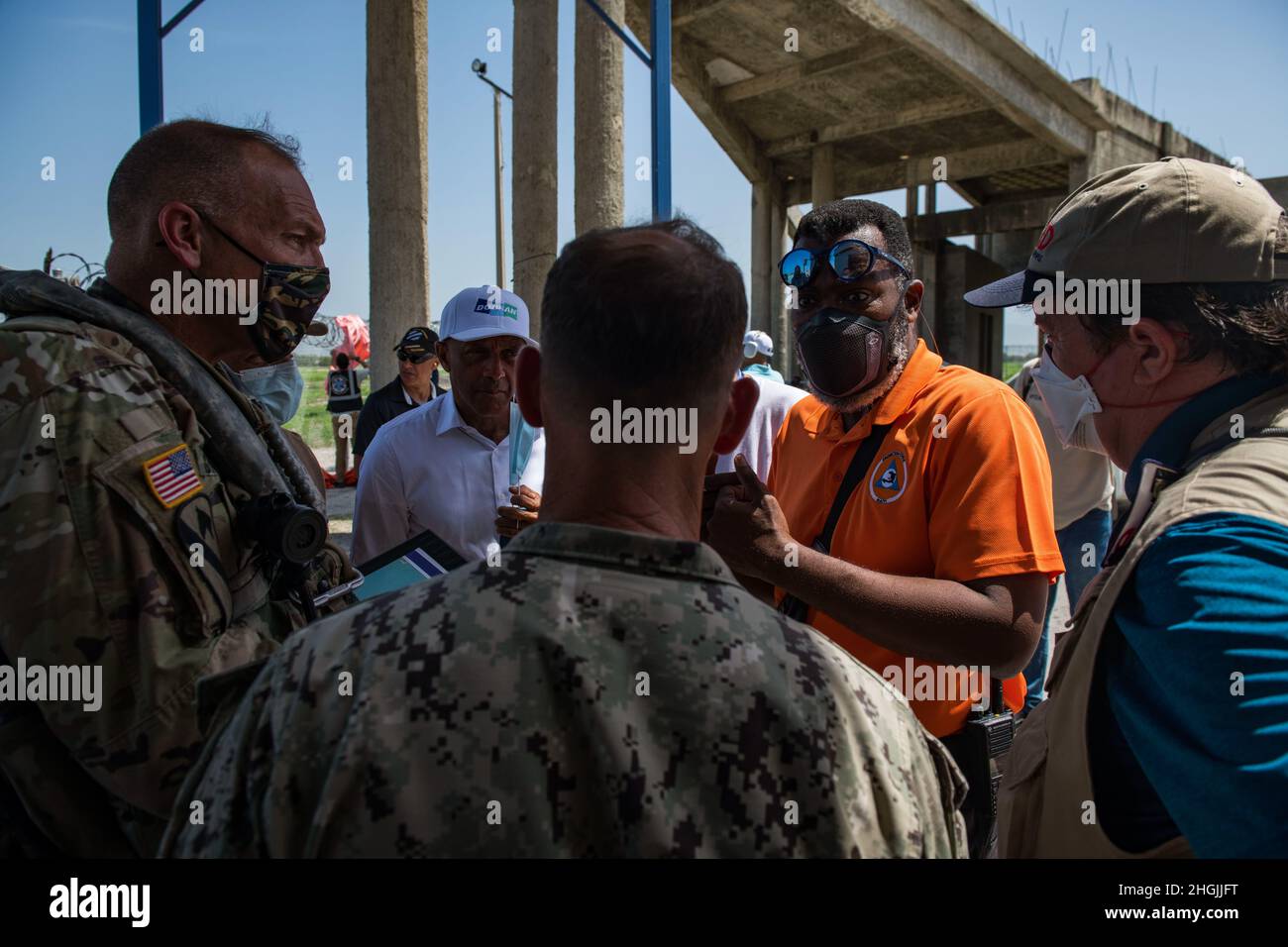 U.S. Navy Rear Adm. Keith Davids, center, commander of Joint Task Force ...