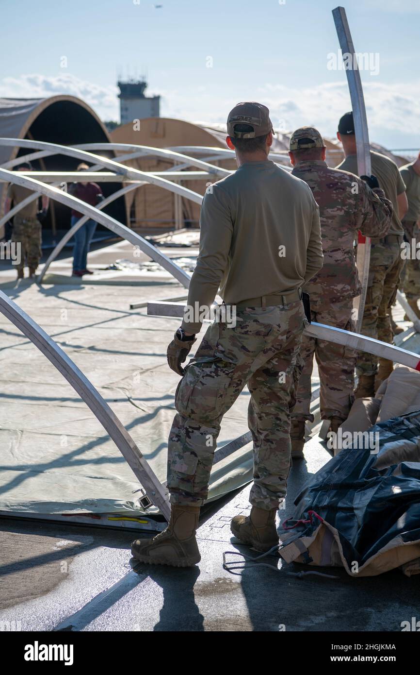 U.S. Air Force Airmen assigned to the 786th Civil Engineering Squadron ...