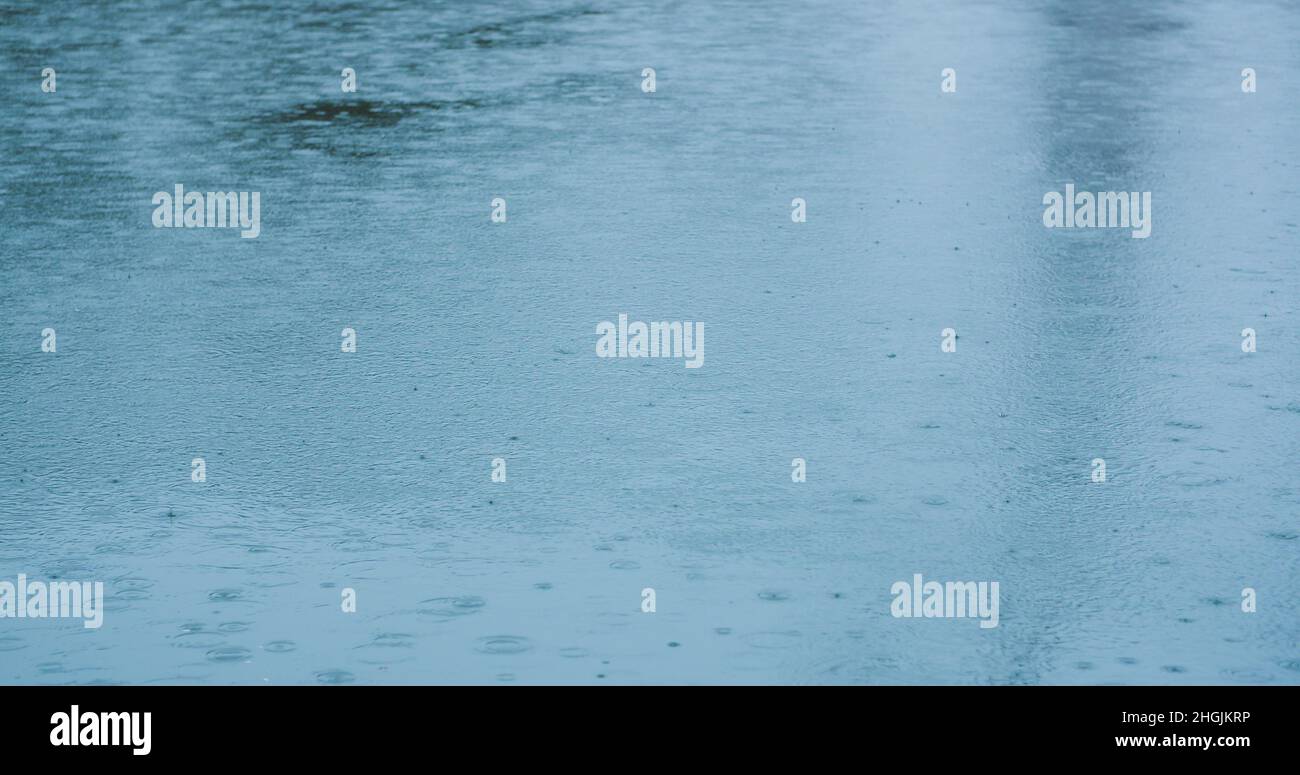 Heavy Rain Raining on a Water Surface Stock Photo - Alamy