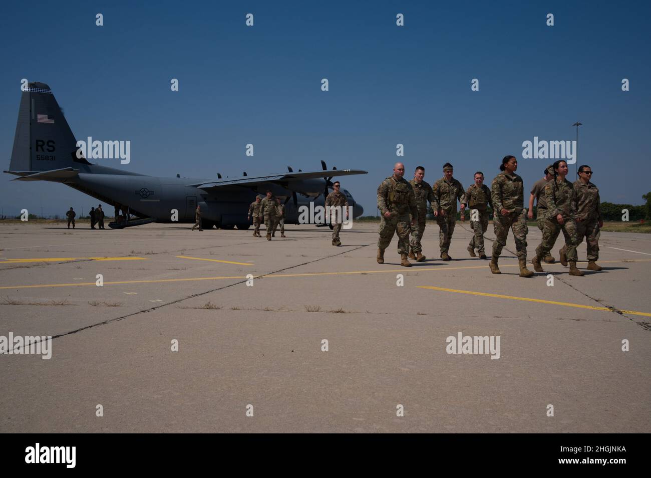 U.S. Air Force Airmen deboard a C-130J Super Hercules aircraft during ...