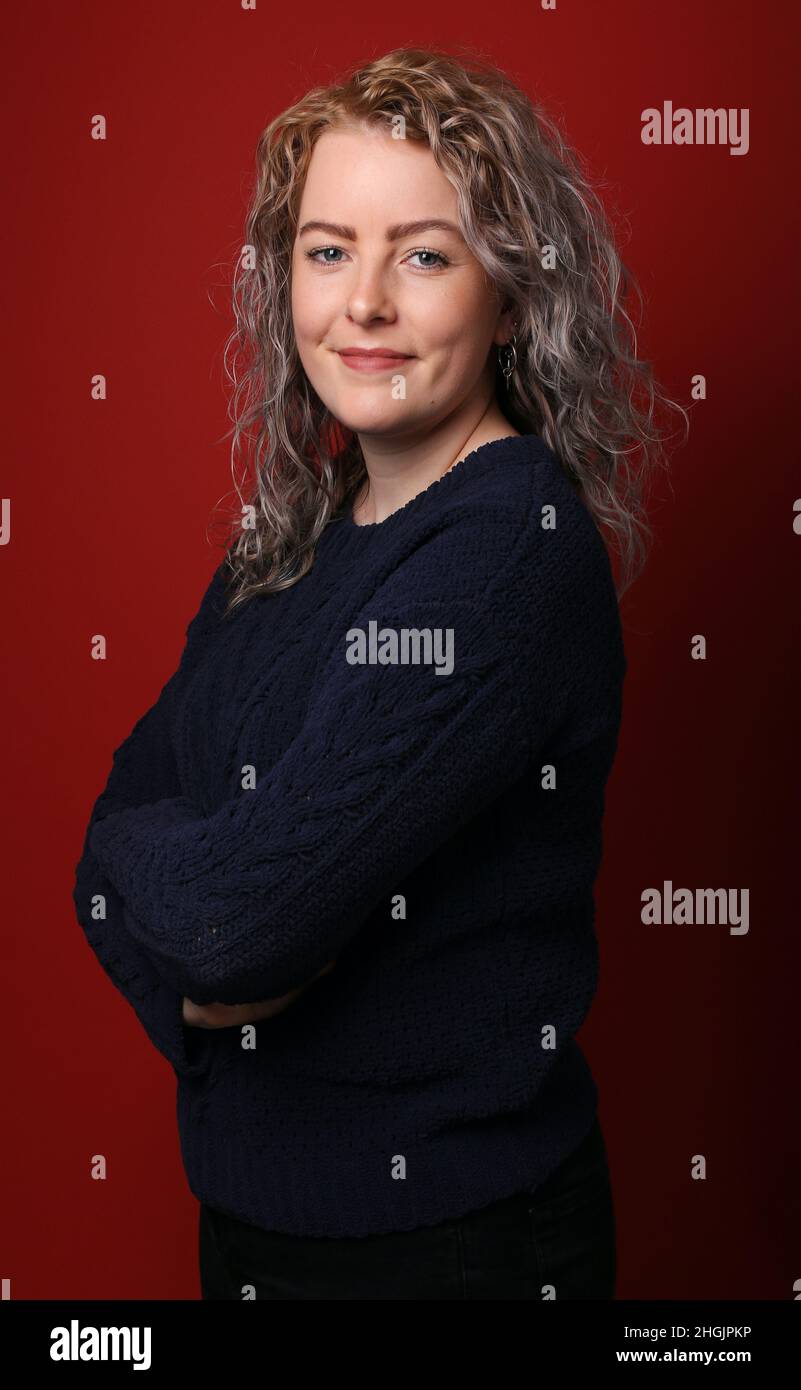 Portrait of a beautiful happy woman in front of a colored background ...