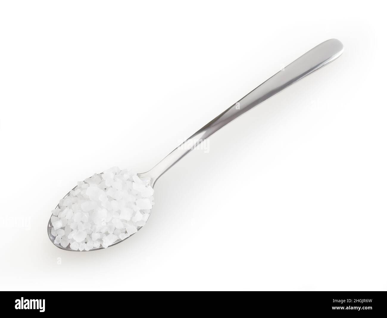 Spoon of sea salt isolated on white background with clipping path Stock ...