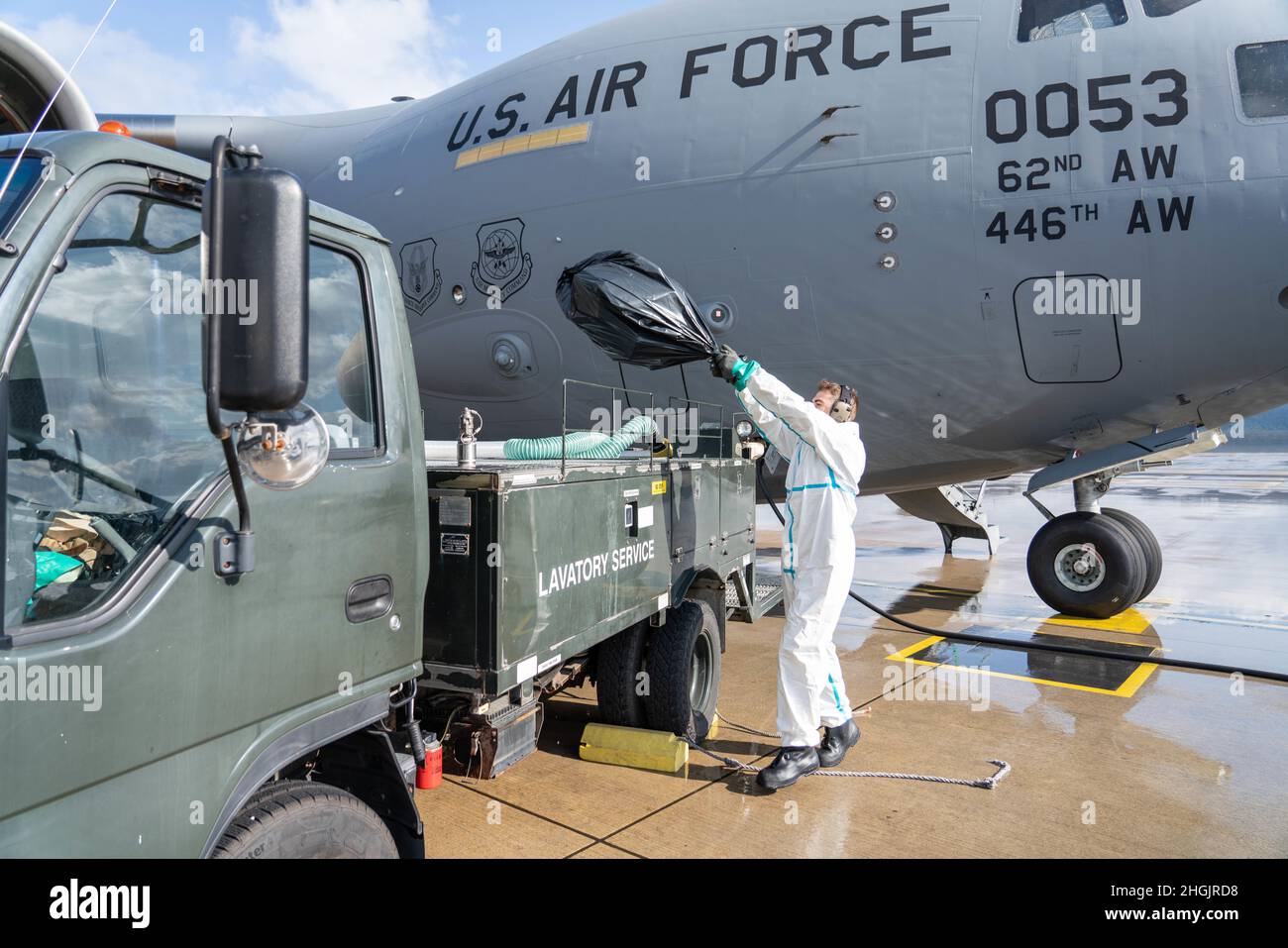 A member of the 721st Aerial Port Squadron fleet services flight ...